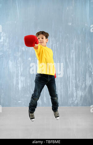 Emotional winner boxer - boy boxing wearing boxing gloves. Isolated on ...