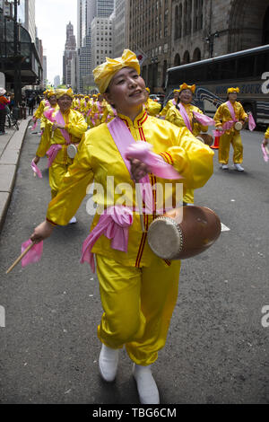 Members of Falun Dafa (Falun Gong) from around the world parade through ...
