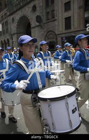 Members of a Falun Gong marching band in the 2011 Lunar New Year parade ...