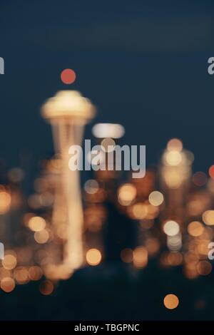 Seattle city skyline bokeh at night with urban office buildings viewed ...