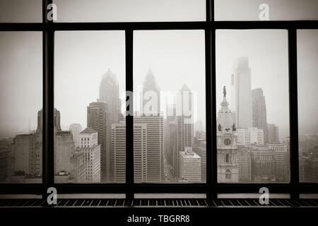 Philadelphia city rooftop view through window Stock Photo - Alamy
