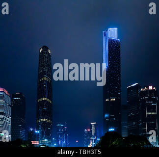 Modern high-rise buildings at the Huacheng Square illuminated at dusk ...