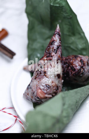 Handmade black rice dumplings Stock Photo - Alamy