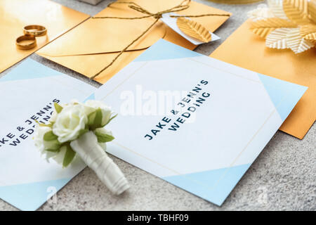 Wedding invitations on grey background Stock Photo - Alamy