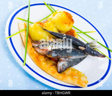 Baked pilchards on sea salt Stock Photo - Alamy