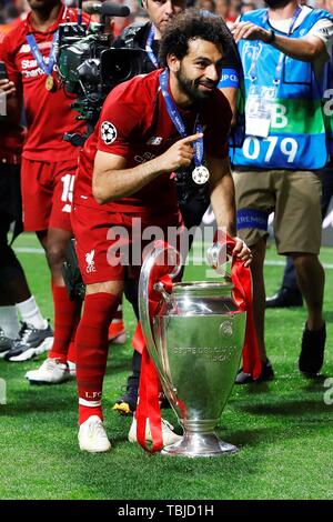 Liverpool's Mohamed Salah celebrates with the trophy after winning the ...