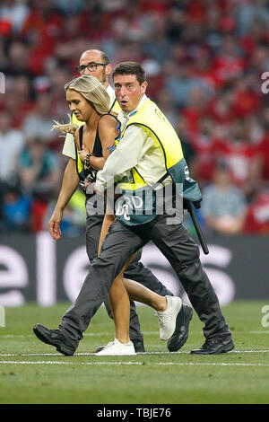 A streaker invades the pitch at the match between Shrewsbury Town and ...