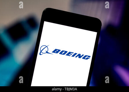 In this photo illustration, The Boeing Company logo seen displayed on a ...