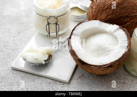 Composition with coconut oil on light background Stock Photo - Alamy