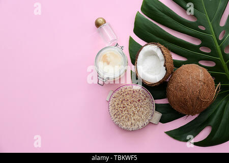 Composition with coconut oil and brush on color background Stock Photo ...