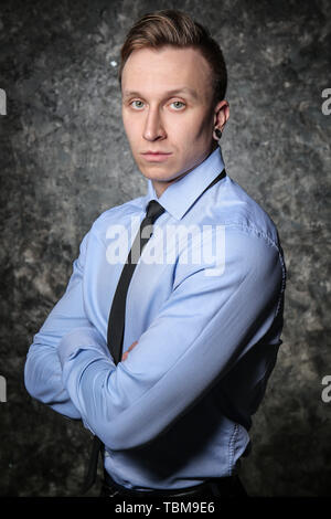 Handsome stylish businessman on grey background Stock Photo - Alamy