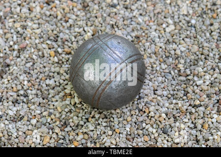 Game of jeu de boule, silver metal balls in sand. A french ball game ...