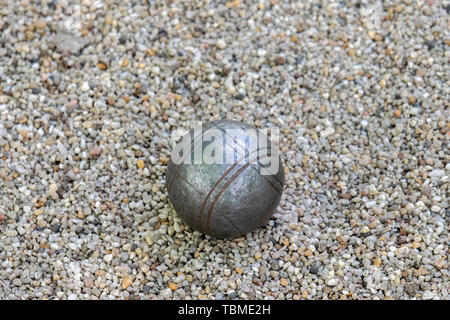 Game of jeu de boule, silver metal balls in sand. A french ball game ...