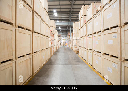 Logistics personnel load and unload cargo at the warehouse Stock Photo ...