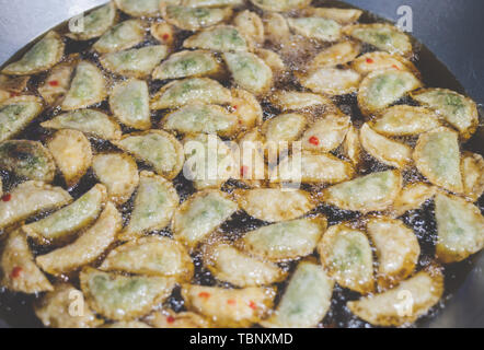 Golden pan-fried Chinese dumplings Jiaozi with premium sea cucumber and ...