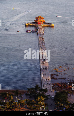 The trestle bridge by the sea, the Qingdao city landscape in the fog ...