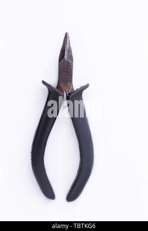 Top view of old wire cutters with rust and dirt from age with plastic ...