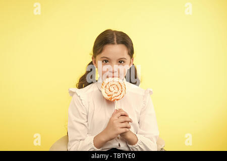 Malnutrition common problem. Girl pupil school uniform likes sweets ...