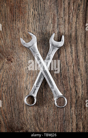 Two wrenches on a wooden background Stock Photo - Alamy