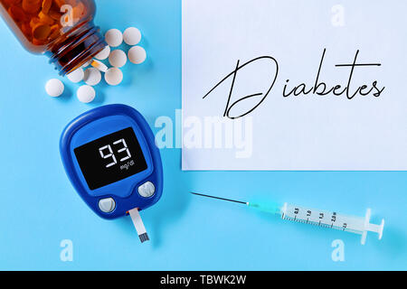 Medical tablet and text Diabetes on screen on wooden table Stock Photo ...