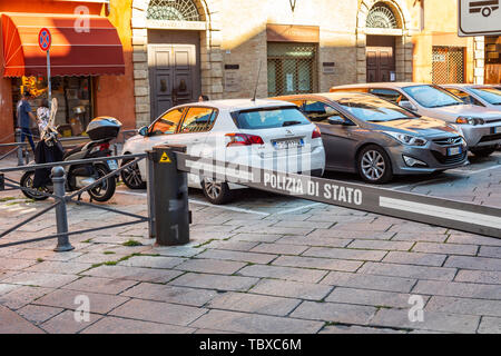 The motorcycle is parked on the street and closed to a special lock ...