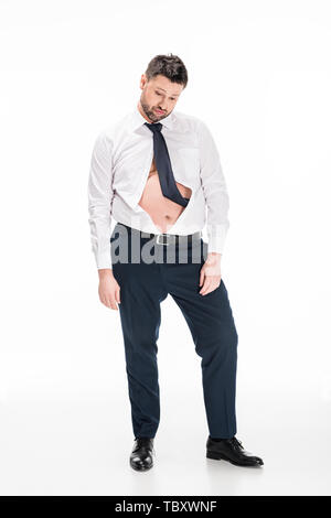 overweight man in tight formal wear posing on white with copy space ...