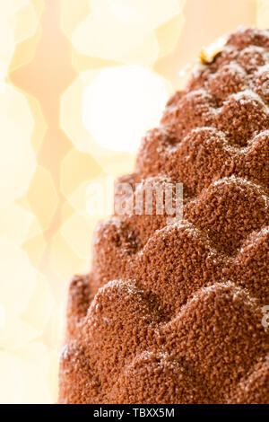 Mini mousse pastry dessert covered with red glazed on garland lamps ...