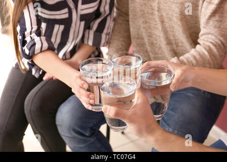 Group of people drinking water indoors Stock Photo - Alamy