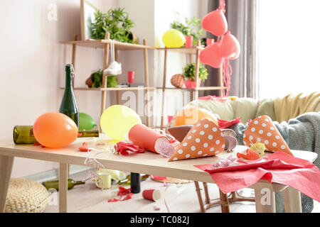 Cleaning of room in terrible mess after party Stock Photo - Alamy