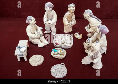 Folk life scene mud sculpture Stock Photo - Alamy