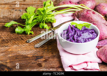 Purple sweet potato mash Stock Photo - Alamy