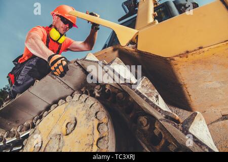 Bulldozer Professional Mechanic. Caucasian Technician Taking Machine ...