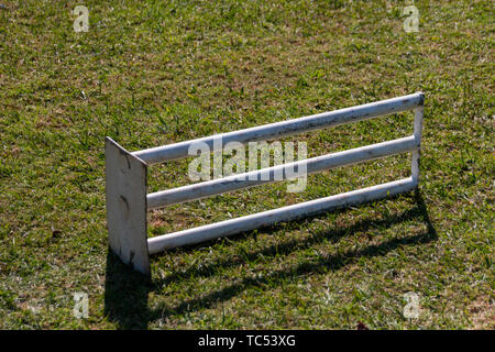 A close uop view of a fallen white metal wicket Stock Photo - Alamy