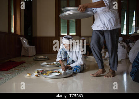 Muslims men break they fasting during Eid Al-Fitr celebration. Eid al ...