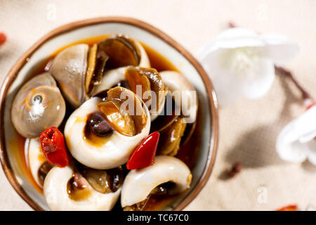 Spicy little seafood snail Stock Photo - Alamy
