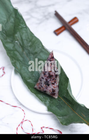 Handmade black rice dumplings Stock Photo - Alamy