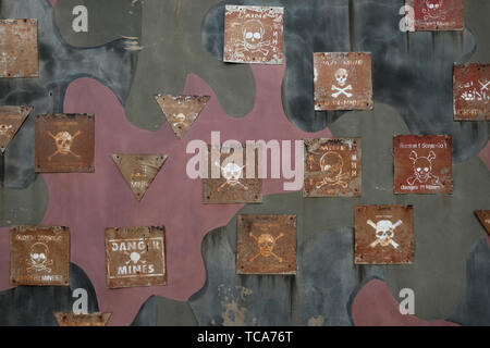 A collection of landmine warning signs from all over the world ...