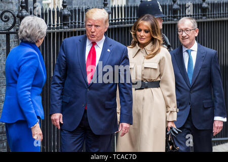 U.S. President Donald Trump is greeted by French President Emmanuel ...