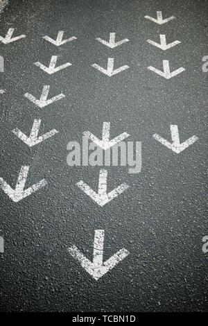 Directional arrows painted on a cement floor Stock Photo - Alamy
