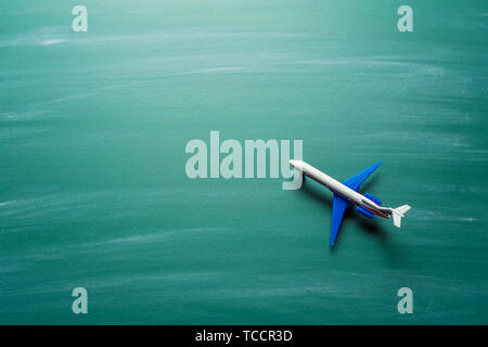 toy airplane over chalkboard background and arrows drawings Stock Photo ...