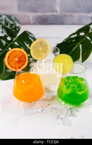 Tri-color cocktail martini with a cherry on a white background Stock ...