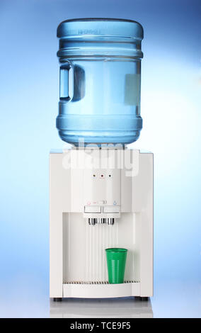 Electric water cooler on blue background Stock Photo - Alamy