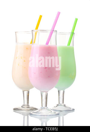 Three different milk shakes with cream and colourful sugar sprinkles ...