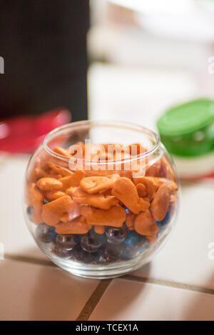 Delicious goldfish crackers in bowl isolated on white Stock Photo - Alamy