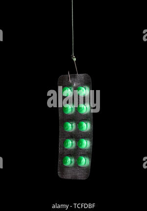 Fishing hook with pill isolated on white background Stock Photo - Alamy
