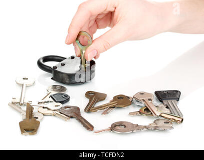 Selecting key to padlock isolated on white Stock Photo - Alamy