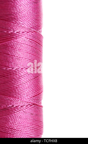 Pink bobbin thread isolated on white Stock Photo - Alamy