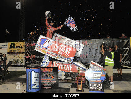 North Dakota, USA. 07th June, 2019. Mark Dobmeier (13) rounds turn one ...