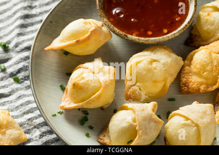 Chinese Cream Cheese Wontons with Sweet and Sour Sauce Stock Photo - Alamy