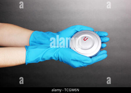 Uranium in hands on grey background Stock Photo - Alamy
